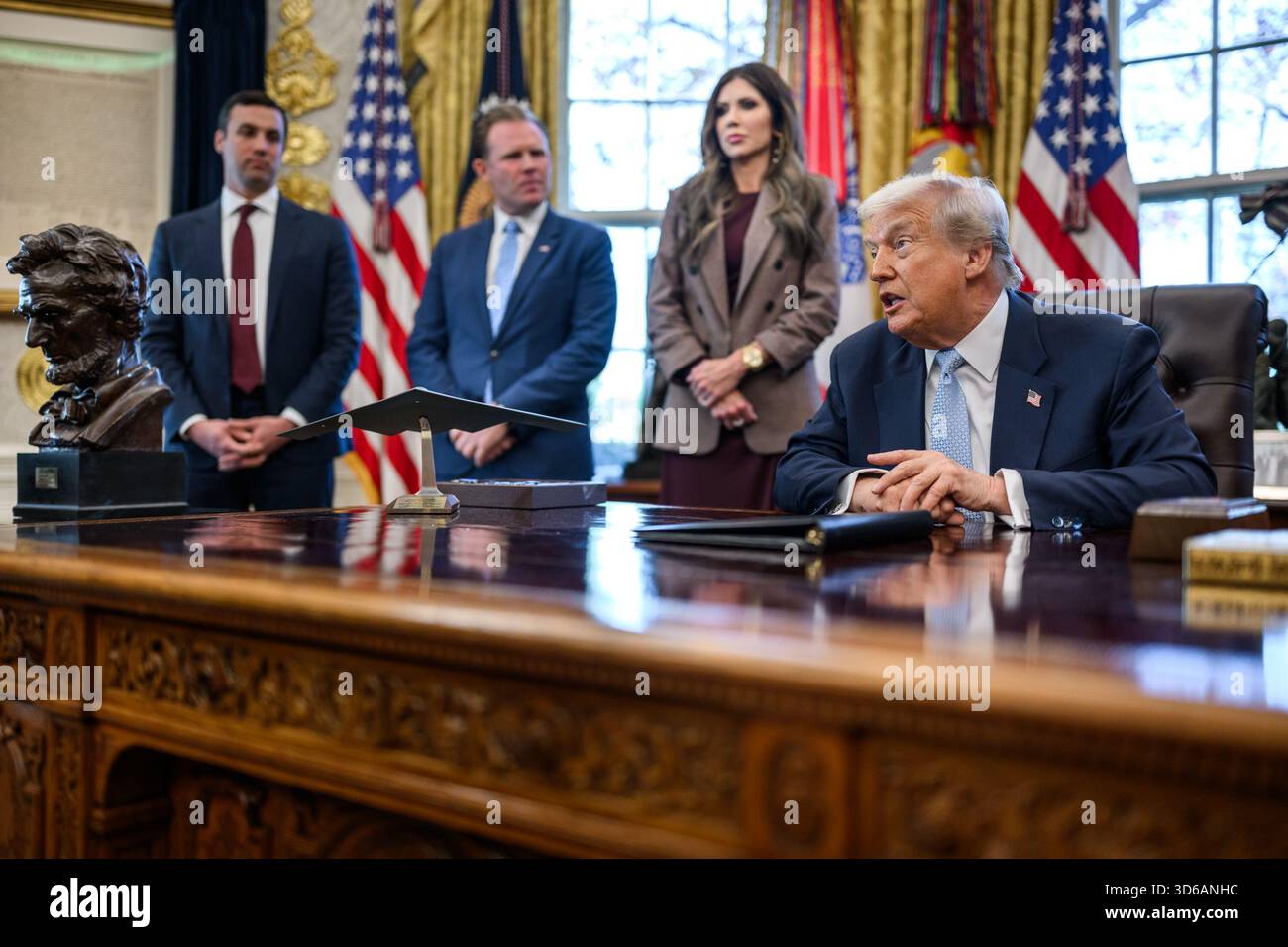 President Donald Trump answers questions from members of the media ...