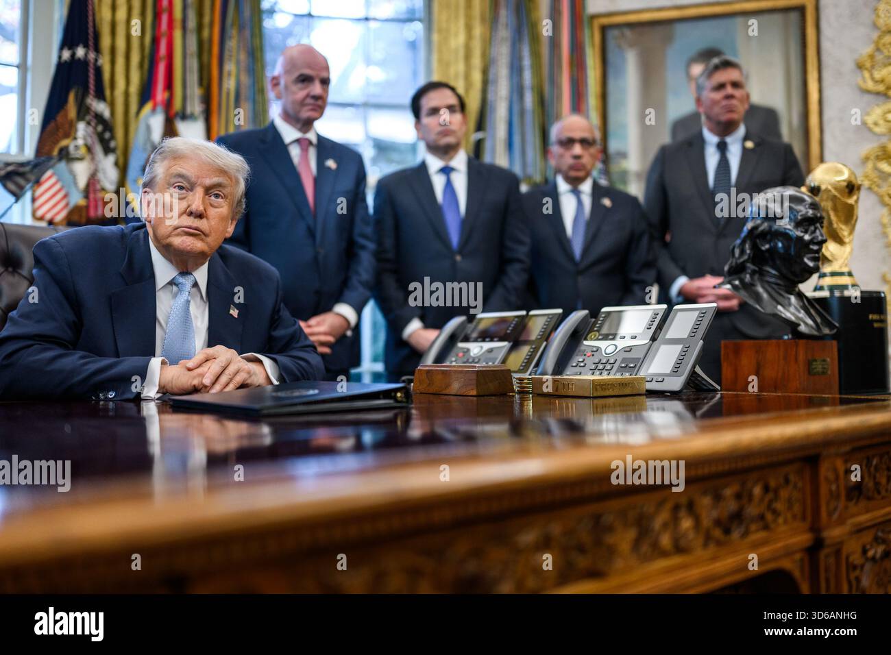President Donald Trump answers questions from members of the media ...