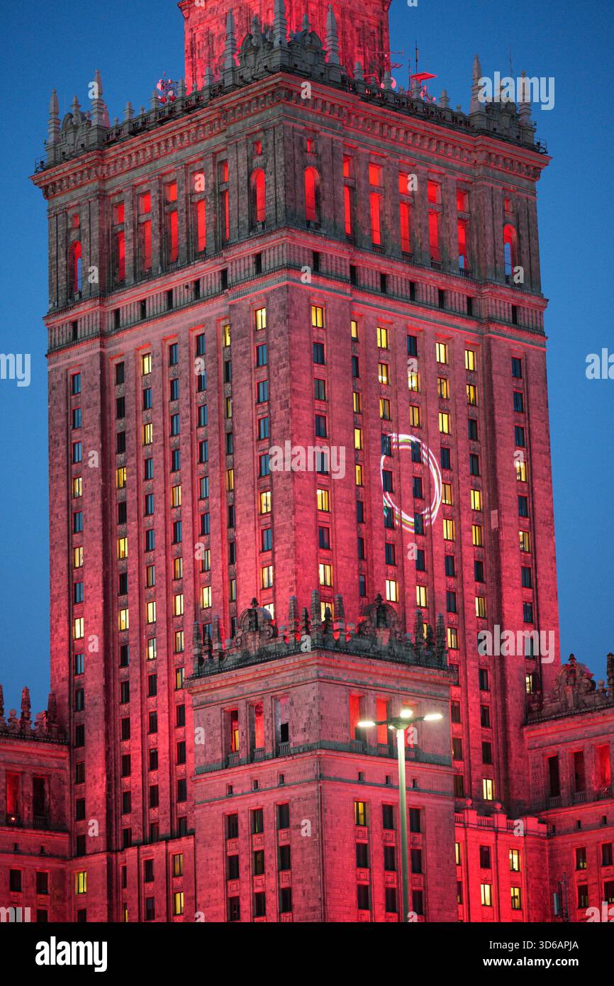 The Palace of Culture and Sciences is seen bathed in red light in ...