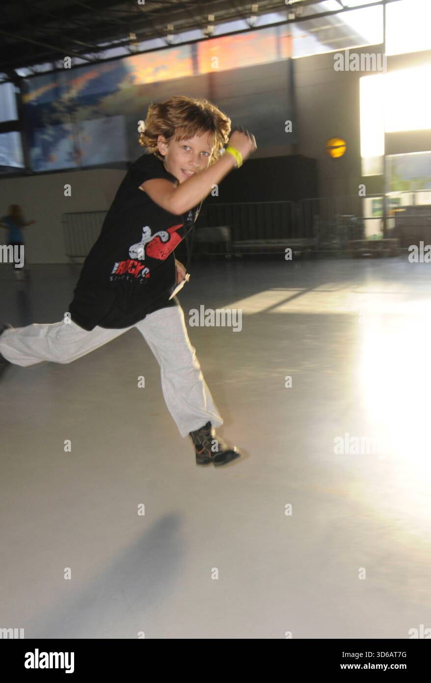 a jumping child or kid, children playing around and exercising a ...