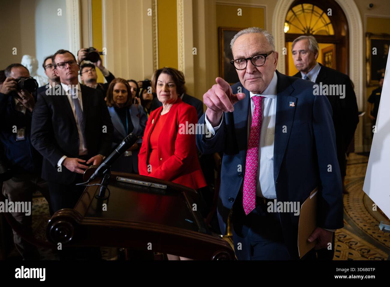 Senate Minority Leader Chuck Schumer (D-N.Y.) calls on a reporter ...