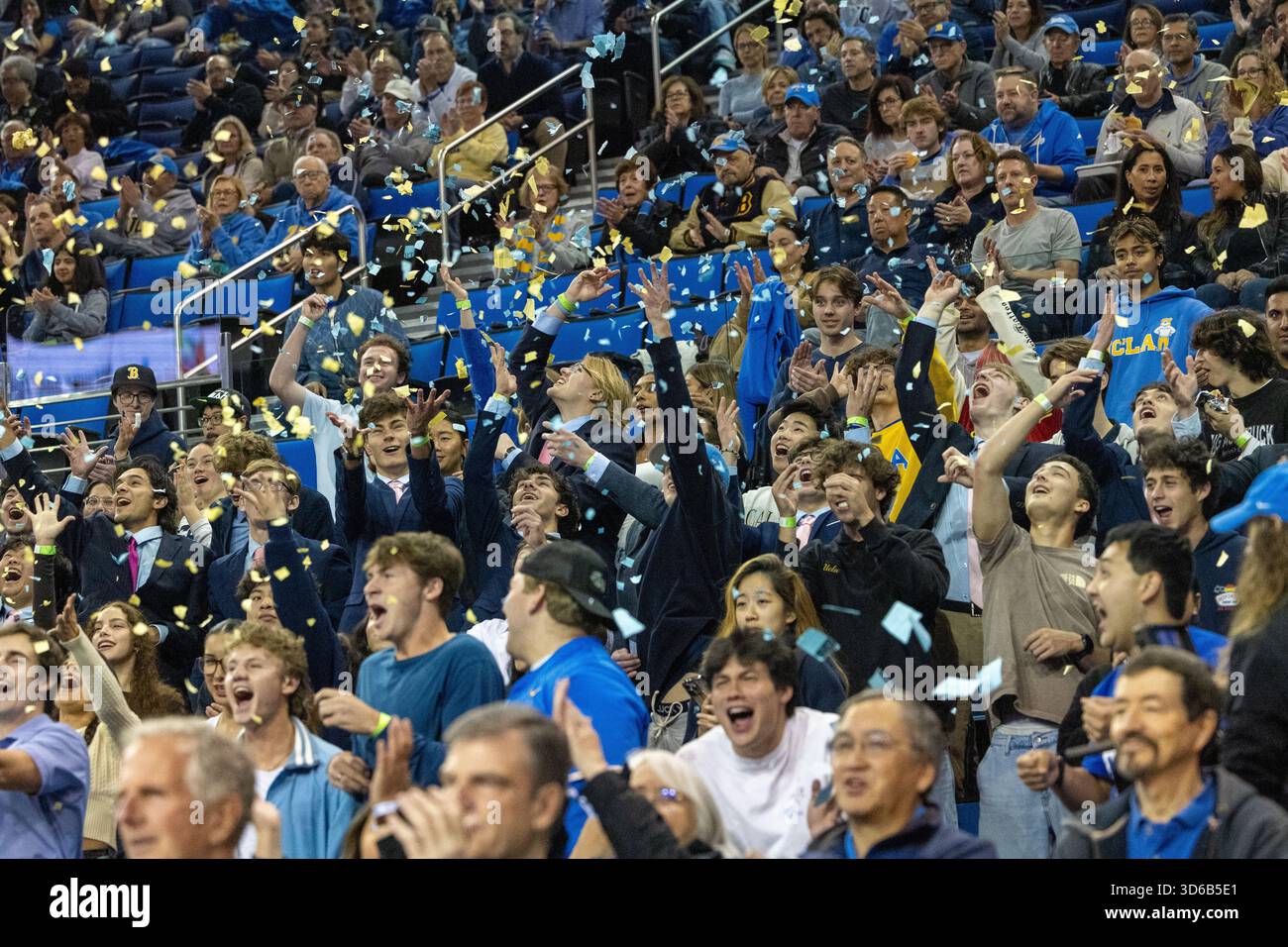 LOS ANGELES, CA - NOVEMBER 18: UCLA Bruins fans toss paper in the air ...