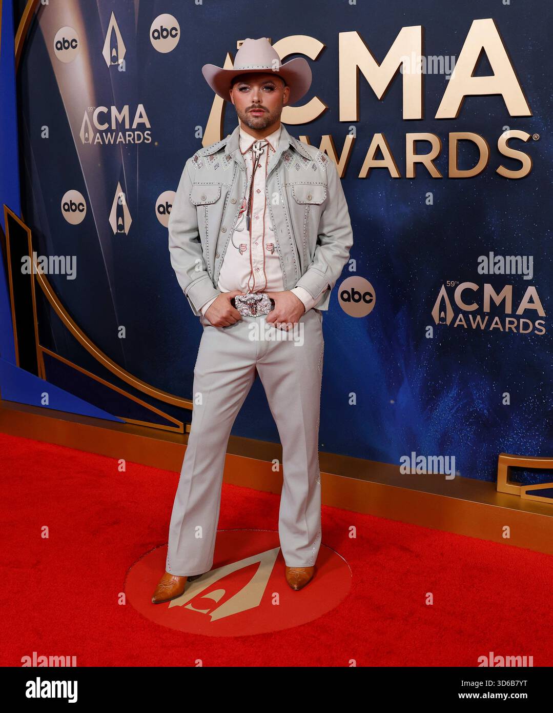 Adam Mac arrives on the red carpet for the 59th CMA Awards in Nashville ...