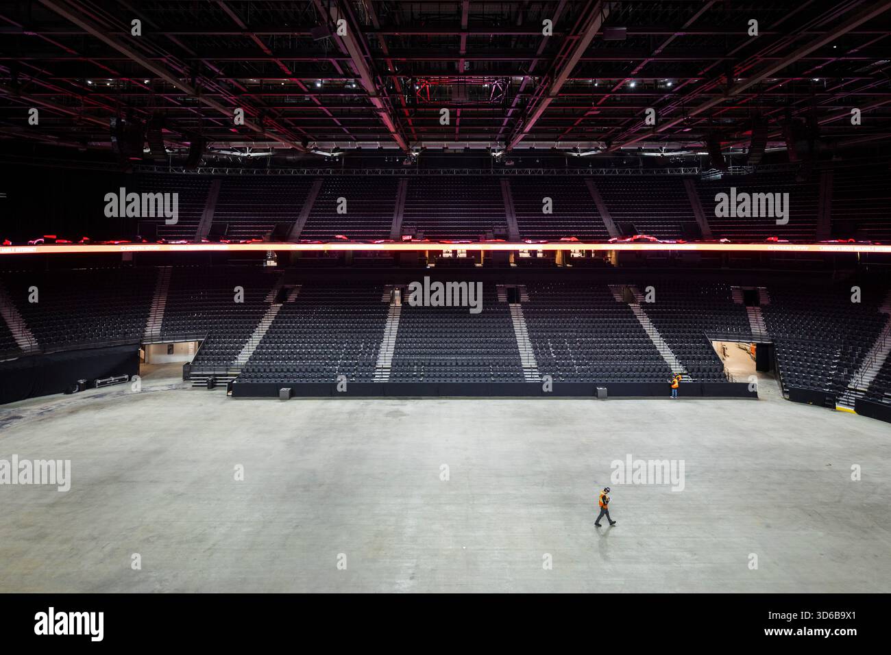 A construction worker walks along the floor at TD Coliseum, the ...