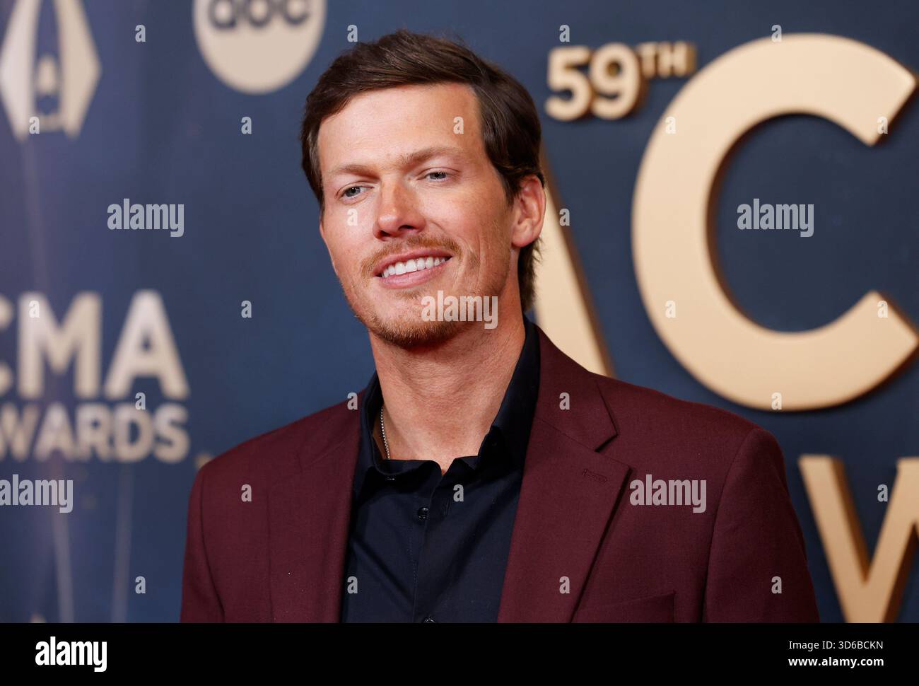 George Birge arrives on the red carpet for the 59th CMA Awards in ...