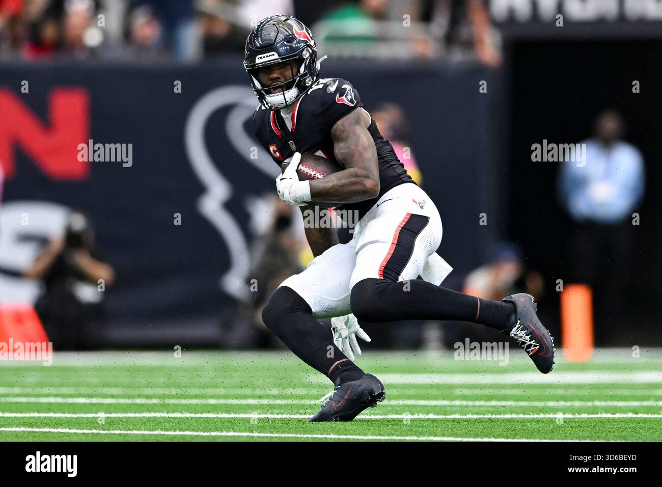 Houston Texans wide receiver Nico Collins (12) runs the ball against ...