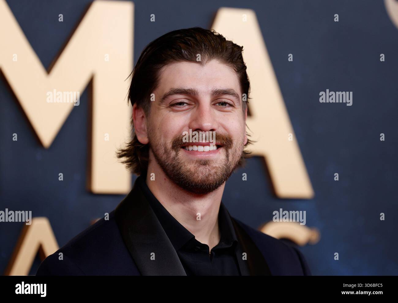 Johnny Clawson arrives on the red carpet for the 59th CMA Awards in ...
