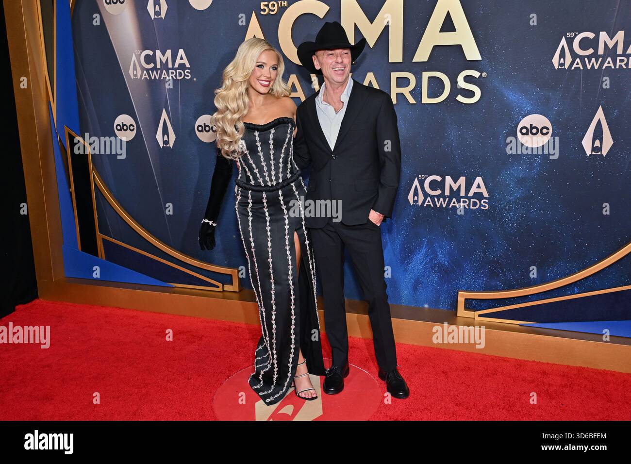 Megan Moroney, left, and Kenny Chesney arrive at the 59th Annual ...
