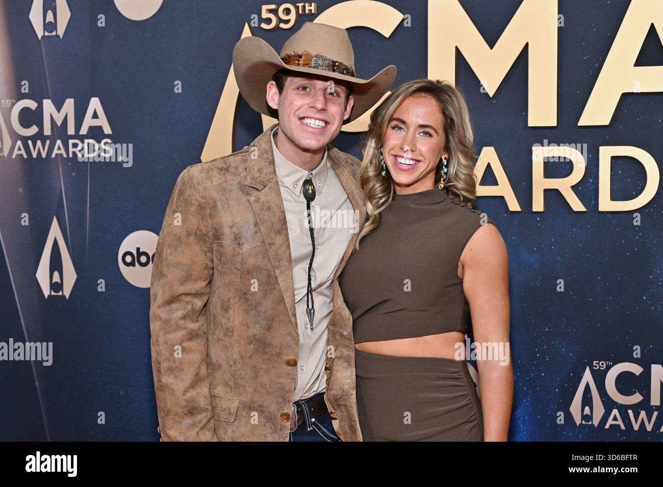 Tanner Smith, left, and Midge Smith arrive at the 59th Annual Country ...