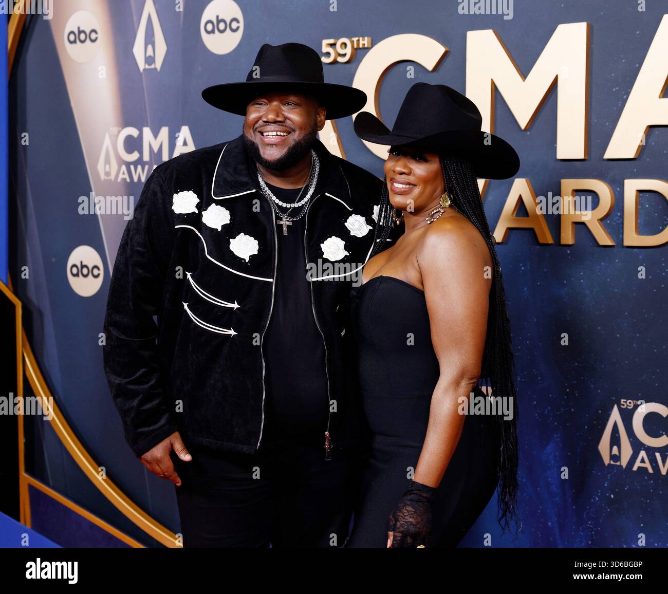 (L-R) Michael Trotter Jr. and Tanya Trotter arrive on the red carpet ...