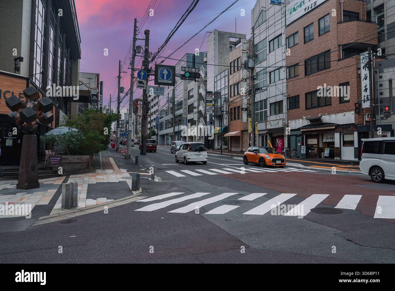 Nara city street at dusk with cars and zebra crossing in Japan Stock ...