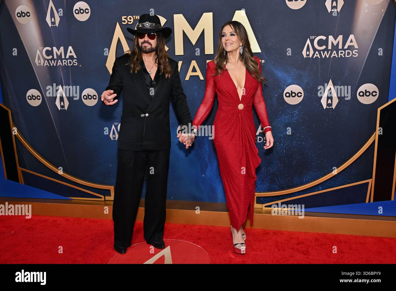 Billy Ray Cyrus, left, and Elizabeth Hurley arrive at the 59th Annual ...