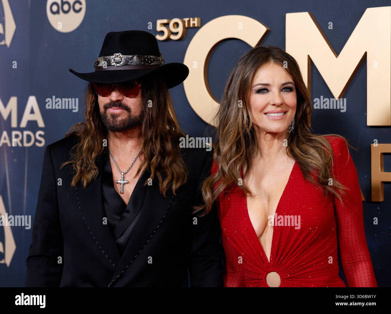 (L-R) Billy Ray Cyrus and Elizabeth Hurley arrive on the red carpet for ...