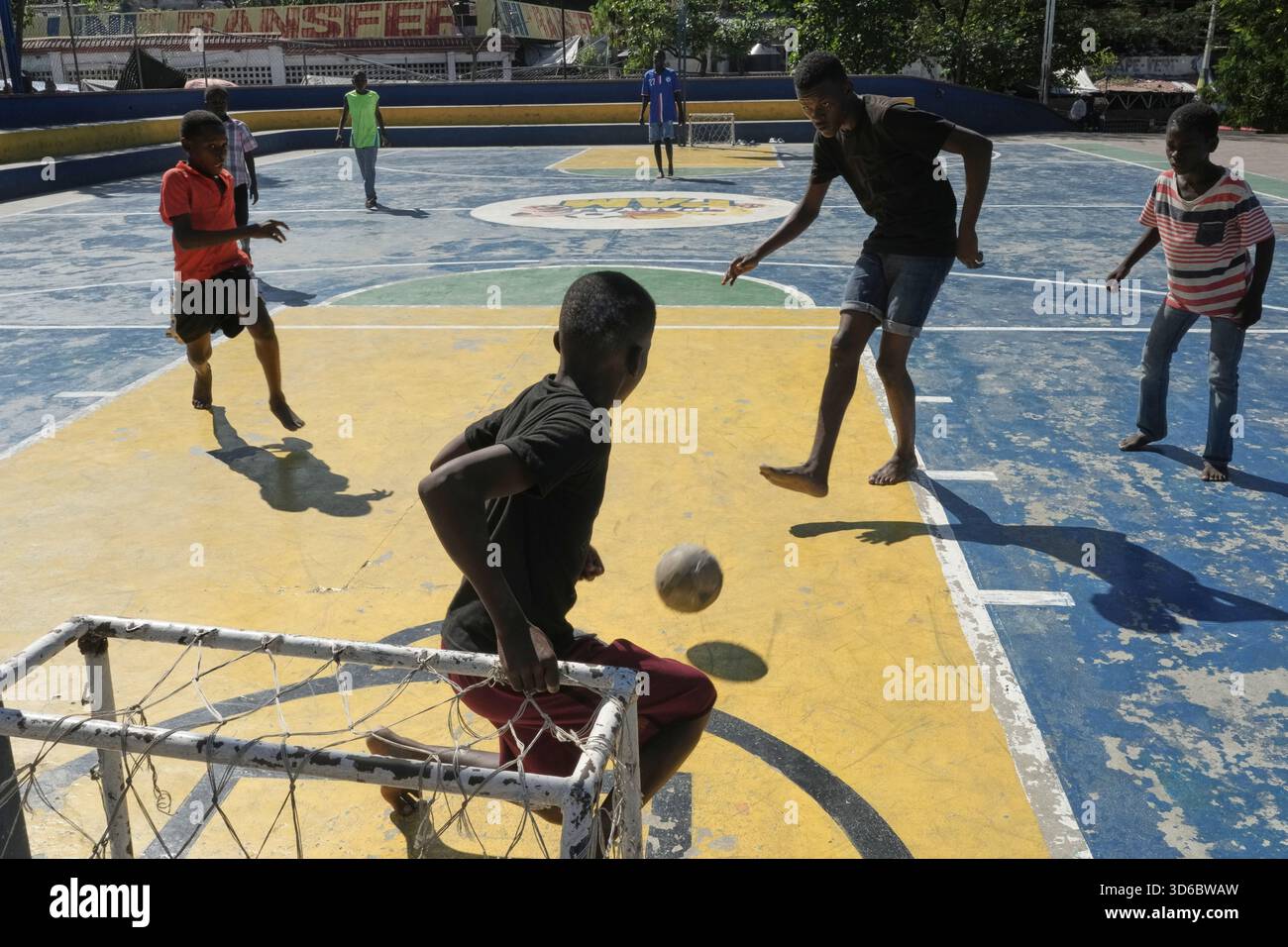 Children play soccer in the Canape-Vert neighborhood of Port-au-Prince ...
