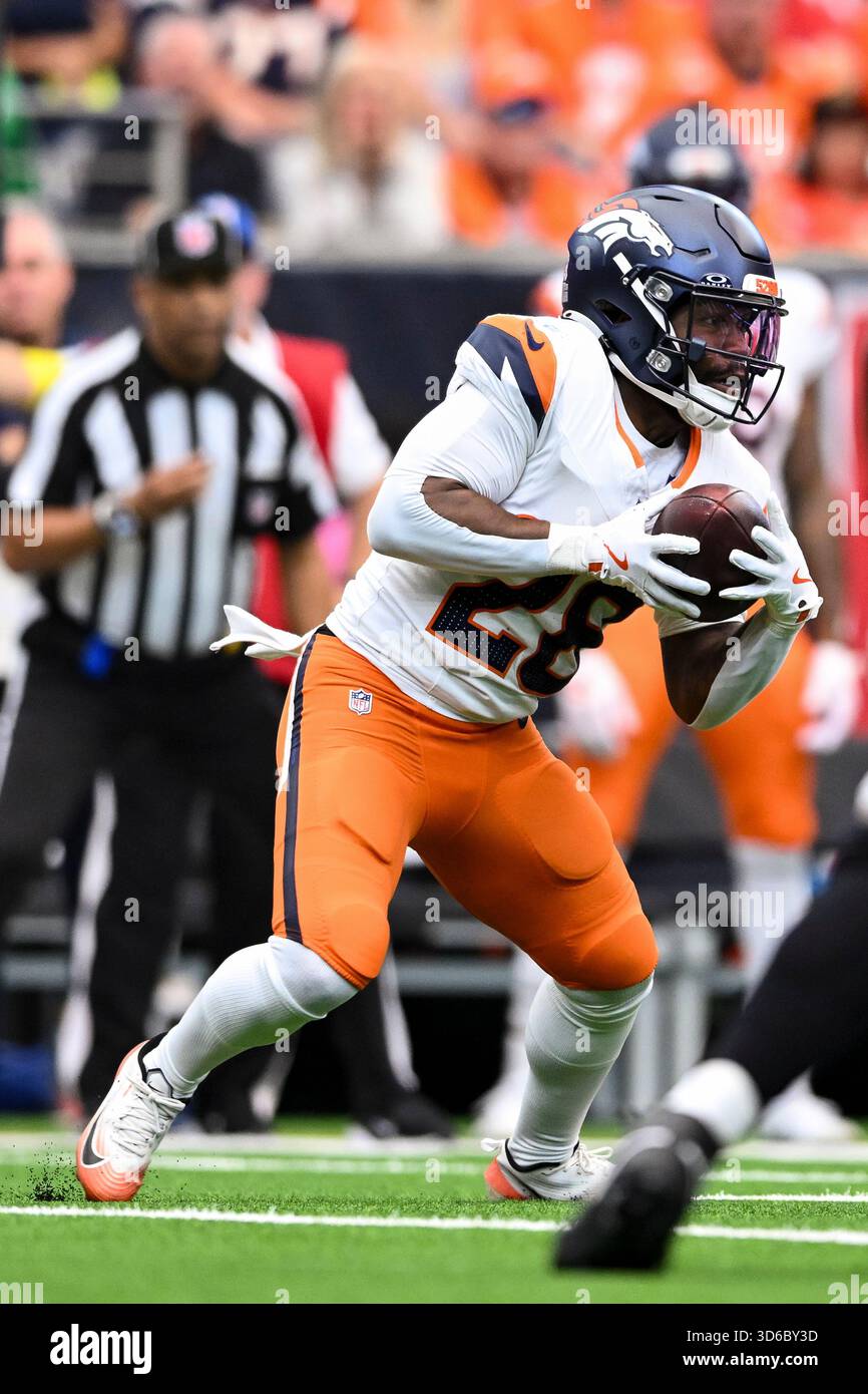 Denver Broncos running back Tyler Badie (28) runs the ball against the ...