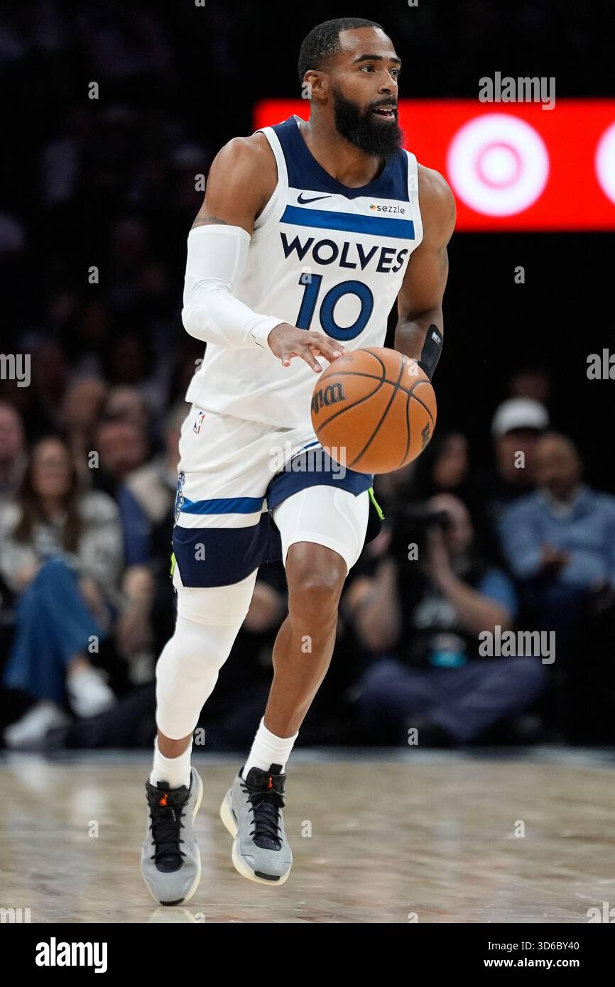 Minnesota Timberwolves guard Mike Conley (10) dribbles down the court ...