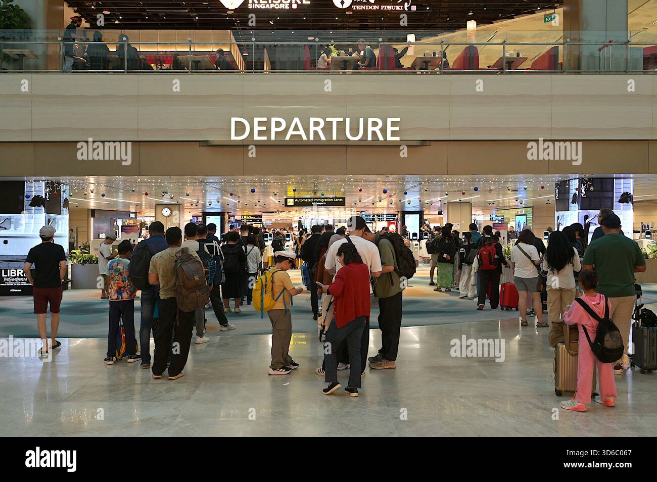 Travelers undergoing security clearance at the automated immigration ...