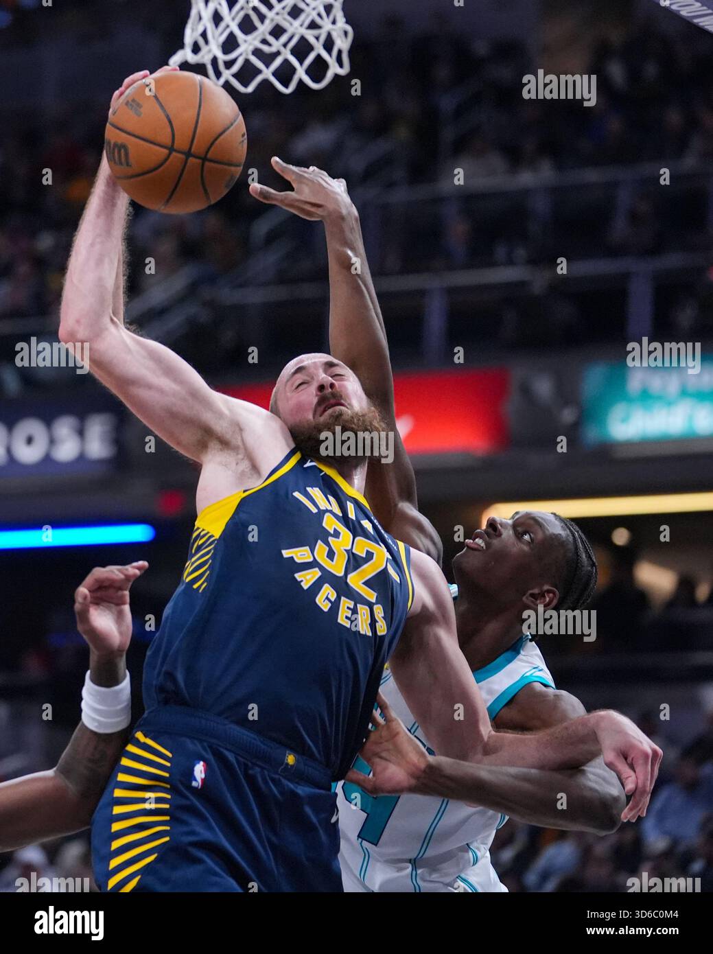Indiana Pacers center Jay Huff (32) grabs a rebound over Charlotte ...