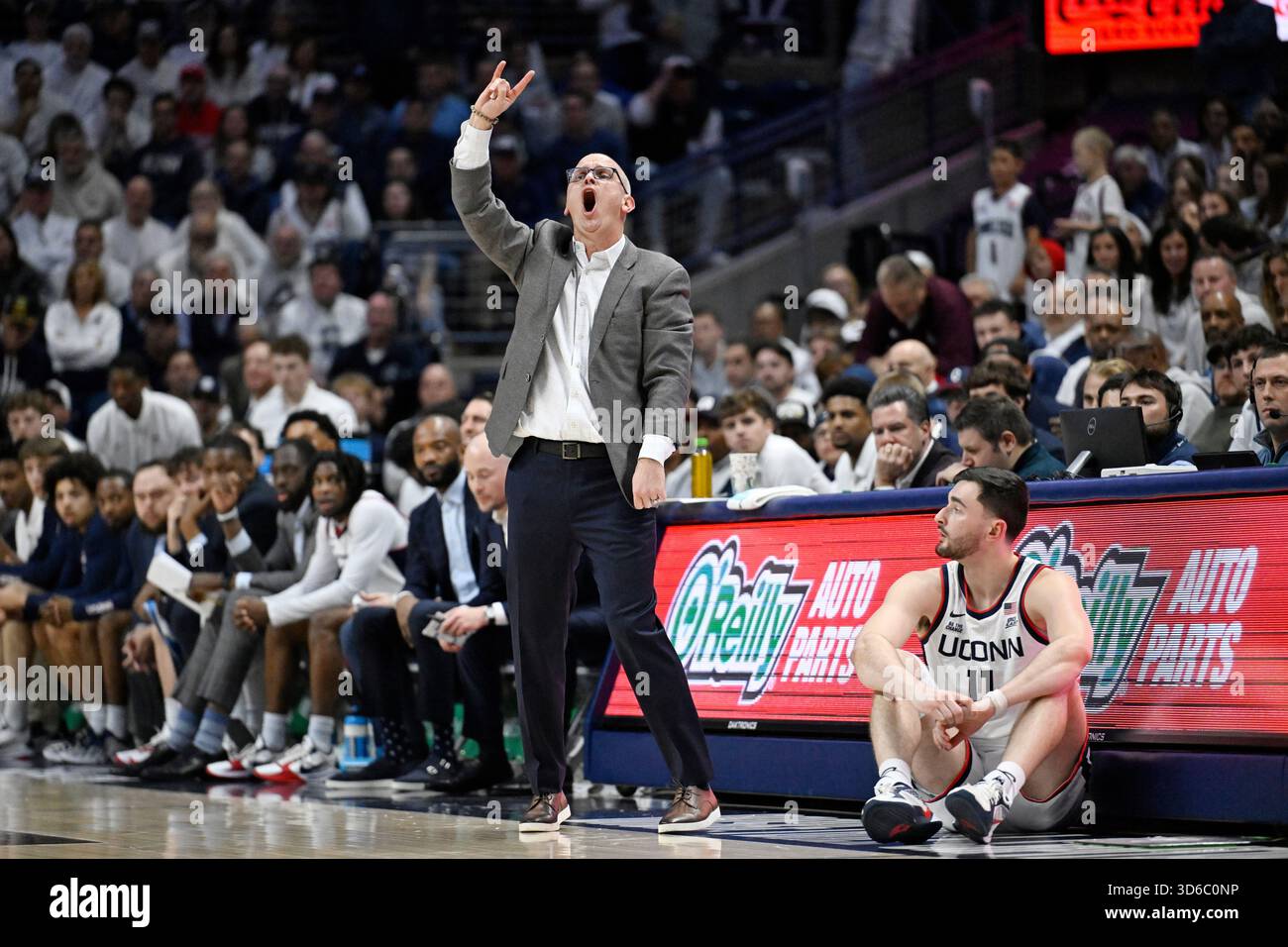 UConn head coach Dan Hurley gestures as UConn forward Alex Karaban ...
