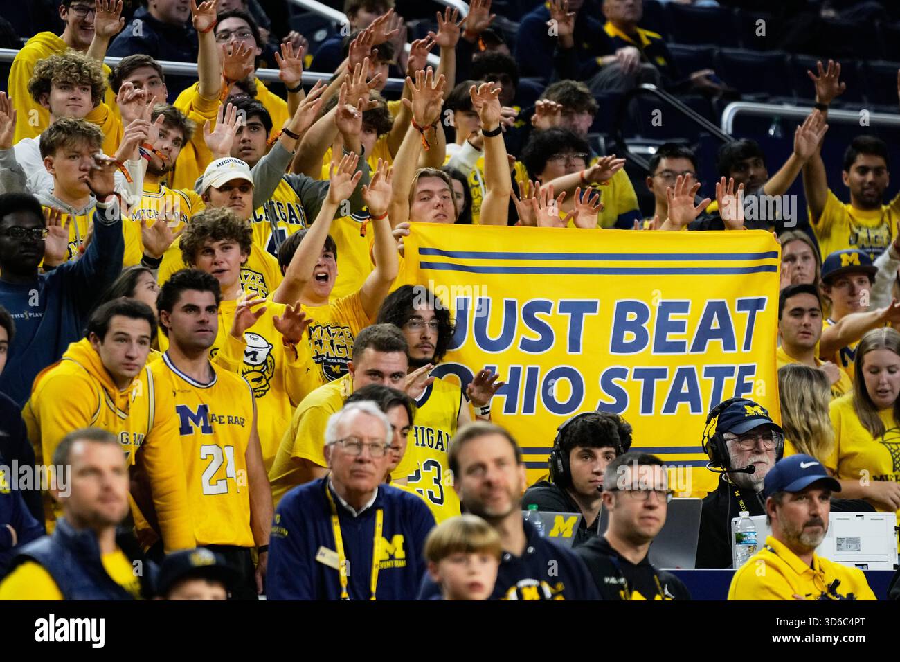 Michigan fans hold up a sign during the second half of an NCAA college ...