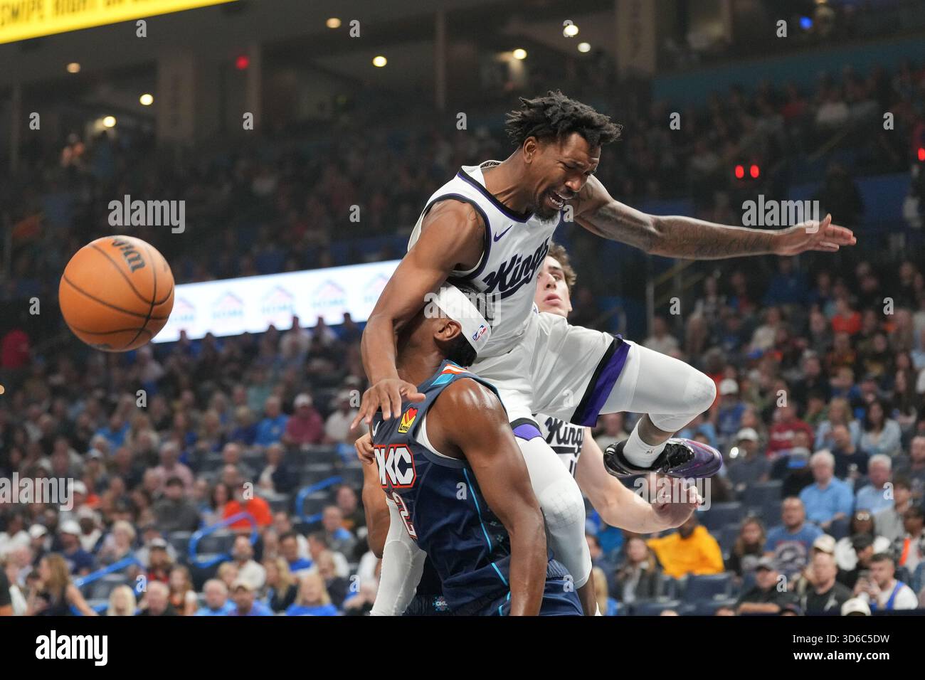 Sacramento Kings guard Malik Monk, right, slams into Oklahoma City ...