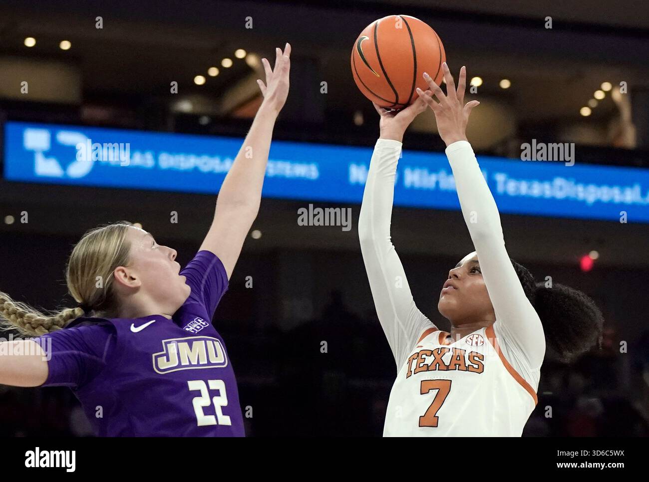 Texas guard Jordan Lee shoots over James Madison forward Grace ...