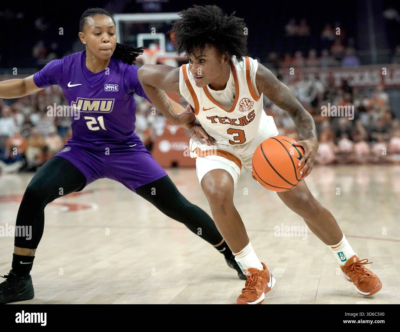Texas guard Rori Harmon drives against James Madison guard Zakiya ...