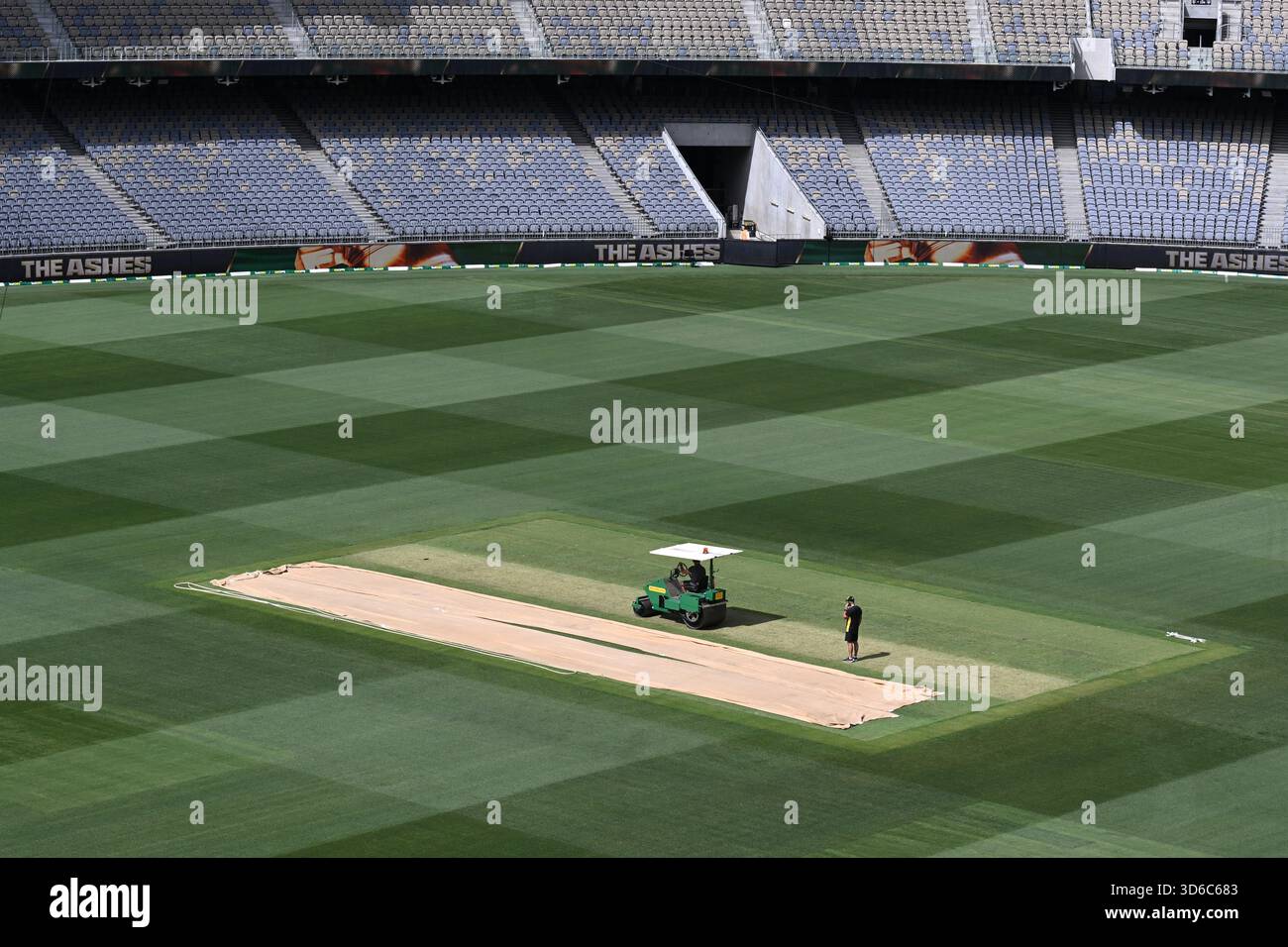 West Australian Head Curator Isaac McDonald rolls the pitch at Perth ...