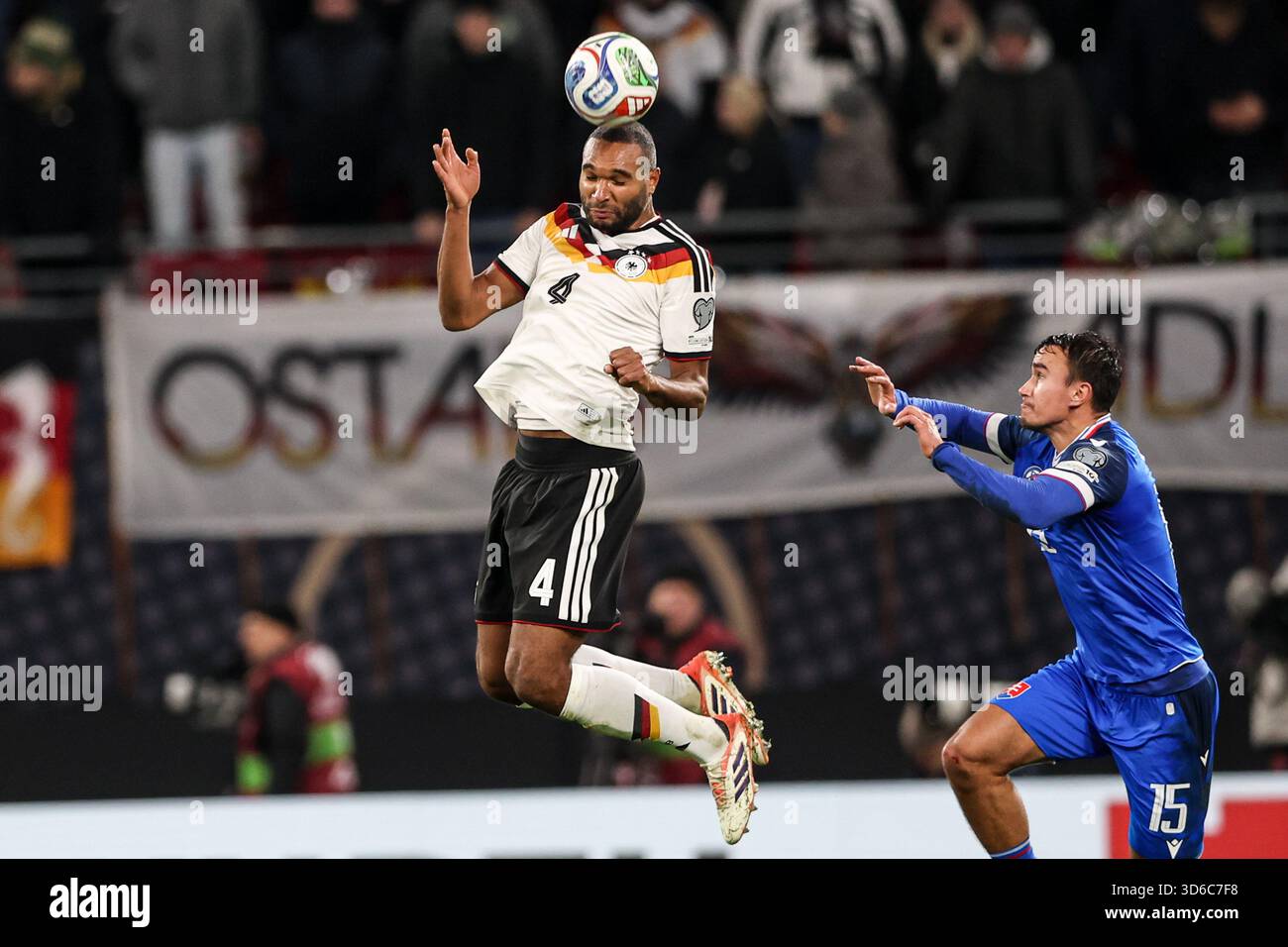 Jonathan Tah of German (L) and David Strelec of Slovakia (R) seen in ...