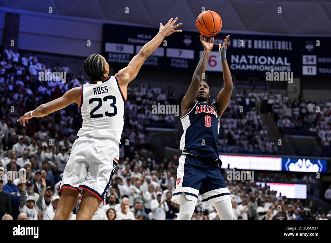 Arizona guard Jaden Bradley (0) shoots over UConn forward Jayden Ross (23) in the second half of ...