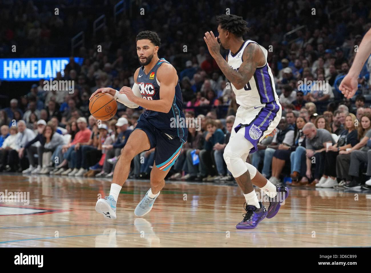 Oklahoma City Thunder guard Ajay Mitchell, left, drives past Sacramento ...