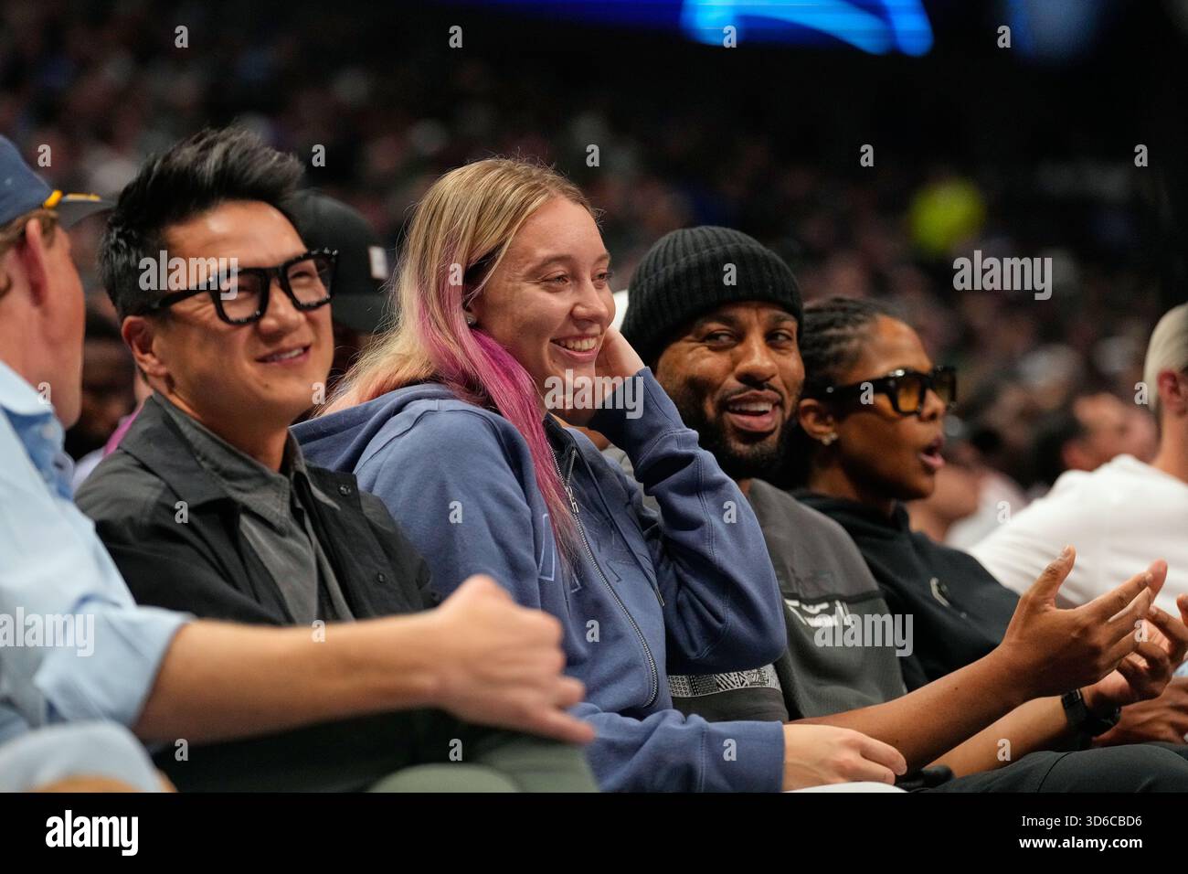 WNBA player Dallas Wings Paige Bueckers, center, sits court side in the ...