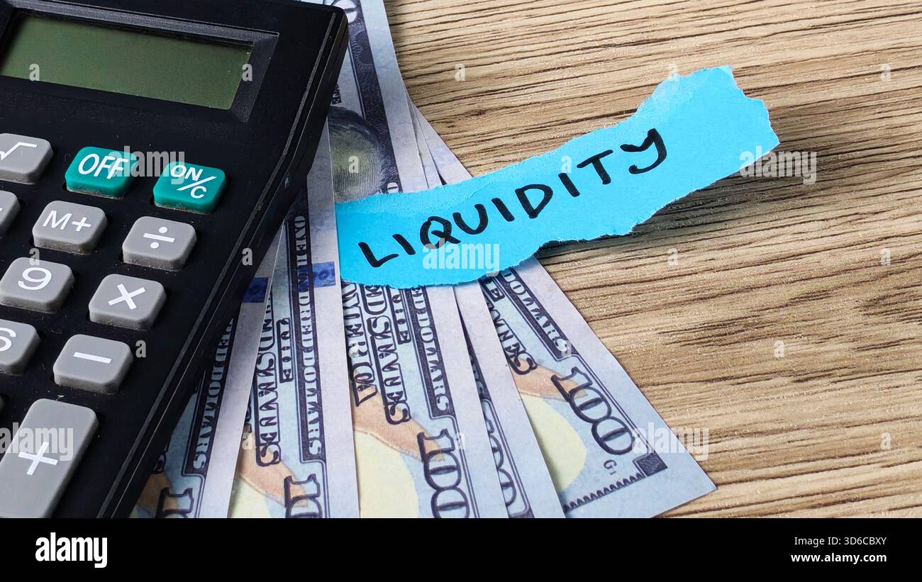 Liquidity Calculation Concept with Calculator, US Dollars, and Note ...
