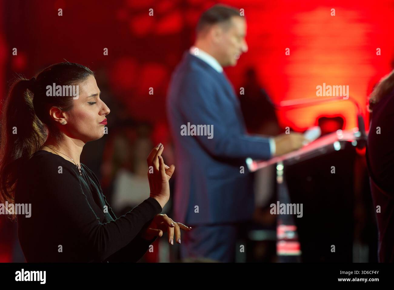 Bucharest, Romania. 19th Nov, 2025: A sign language interpreter (L ...