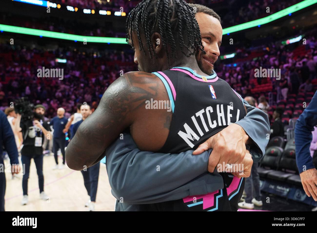 Golden State Warriors guard Stephen Curry, right, hugs Miami Heat guard ...