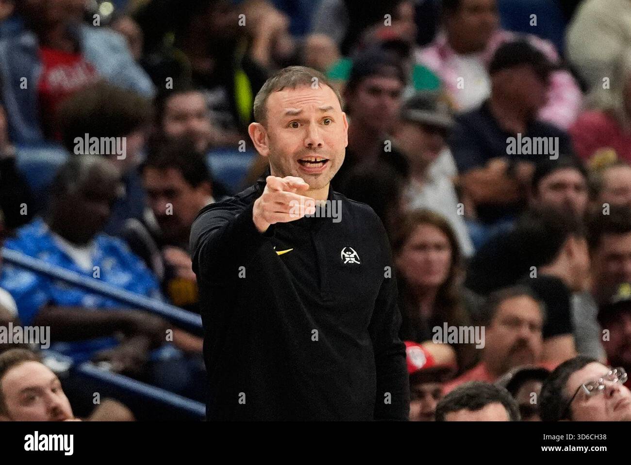 Denver Nuggets head coach David Adelman calls out from the bench in the ...