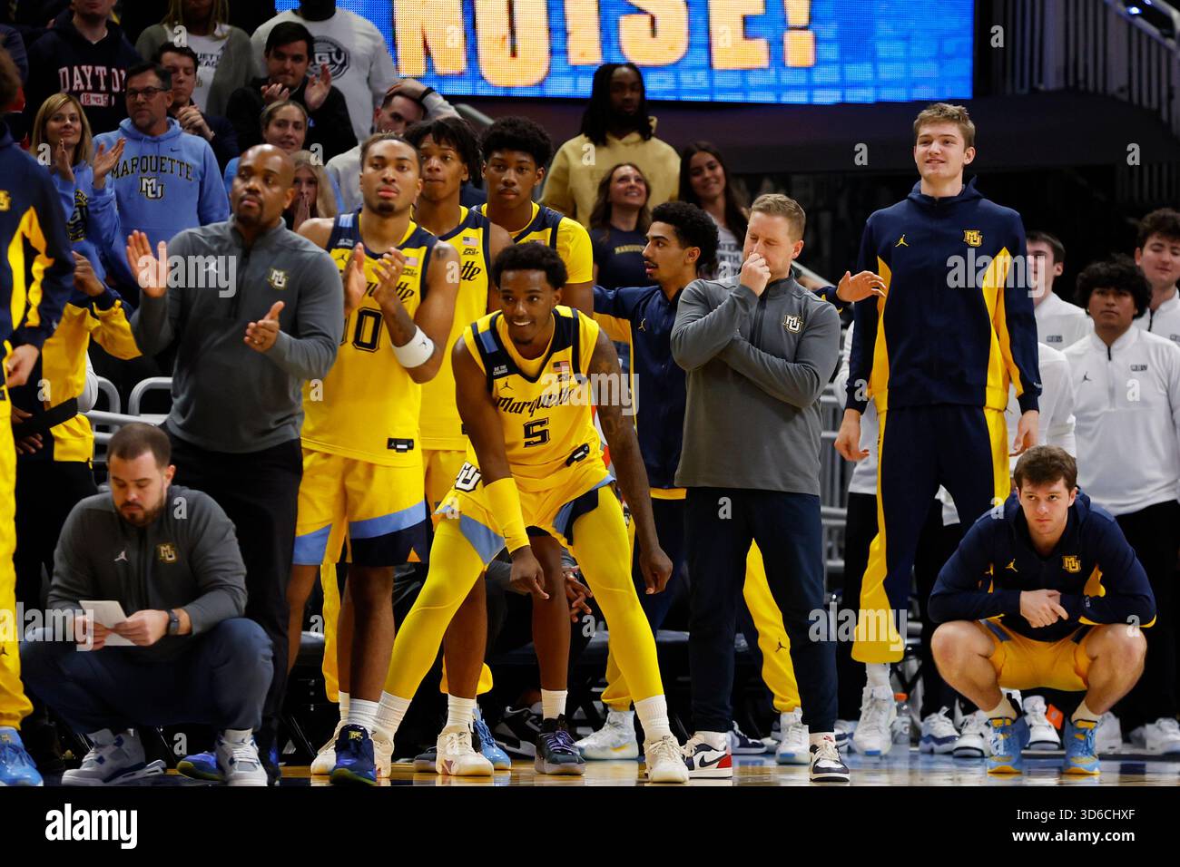 MILWAUKEE, WI - NOVEMBER 19: The Marquette Golden Eagles bench cheers ...