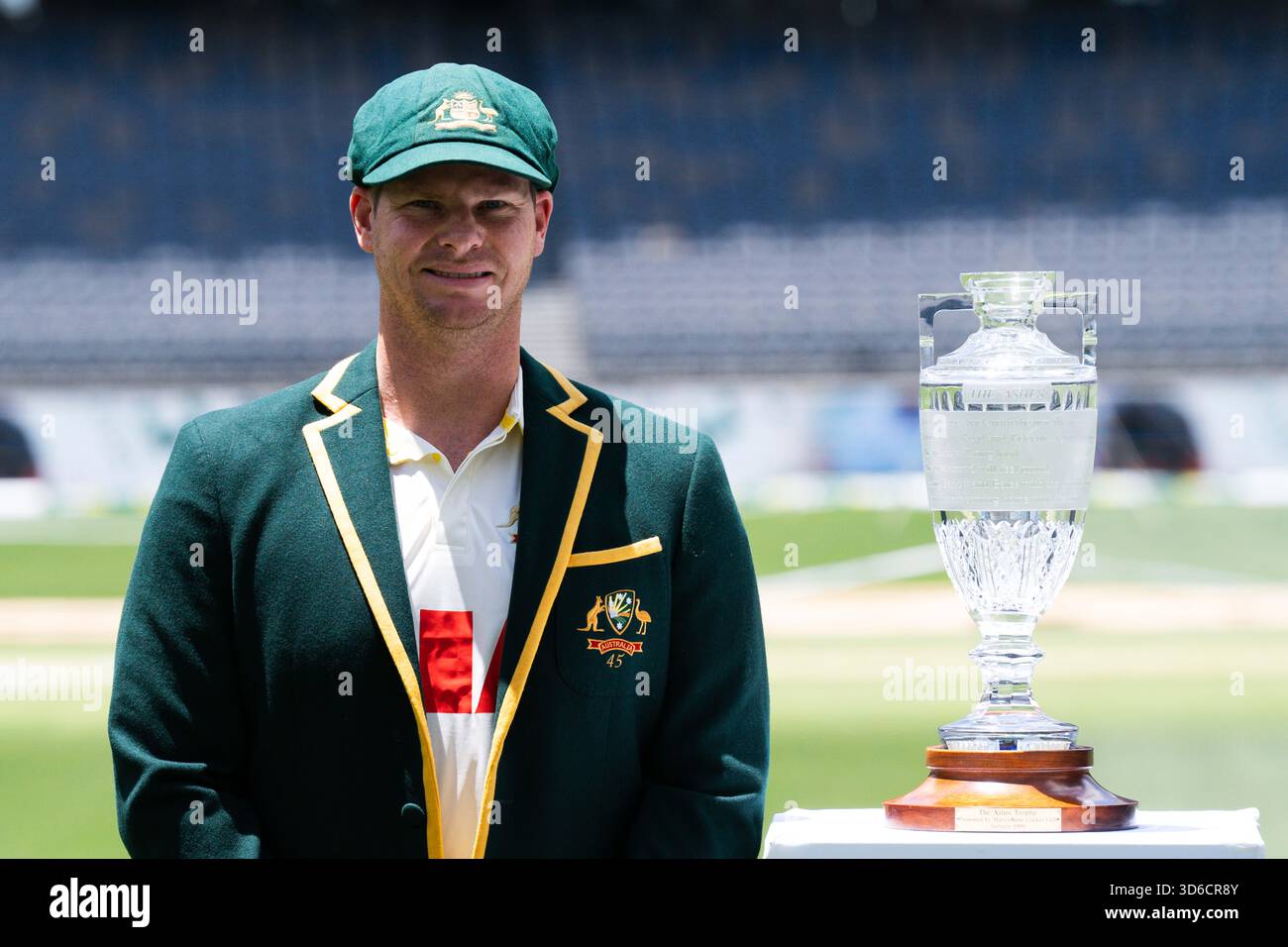 Australia Captain Steve Smith stands with the Waterford Crystal replica ...