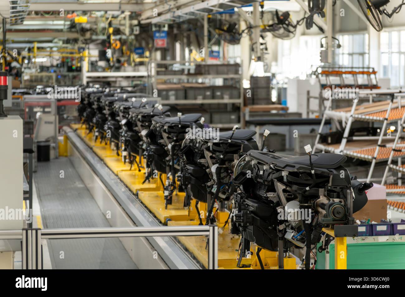 Automated production line moves car chassis or engine assemblies ...