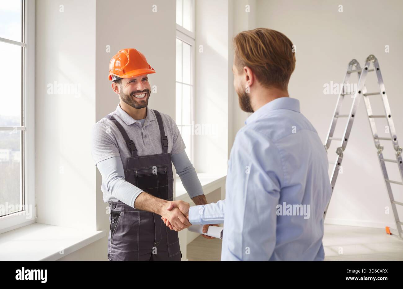 Architect reaching agreement builder hi-res stock photography and ...