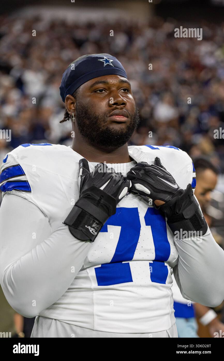 Dallas Cowboys tackle Nate Thomas (71) stands for the national anthem ...