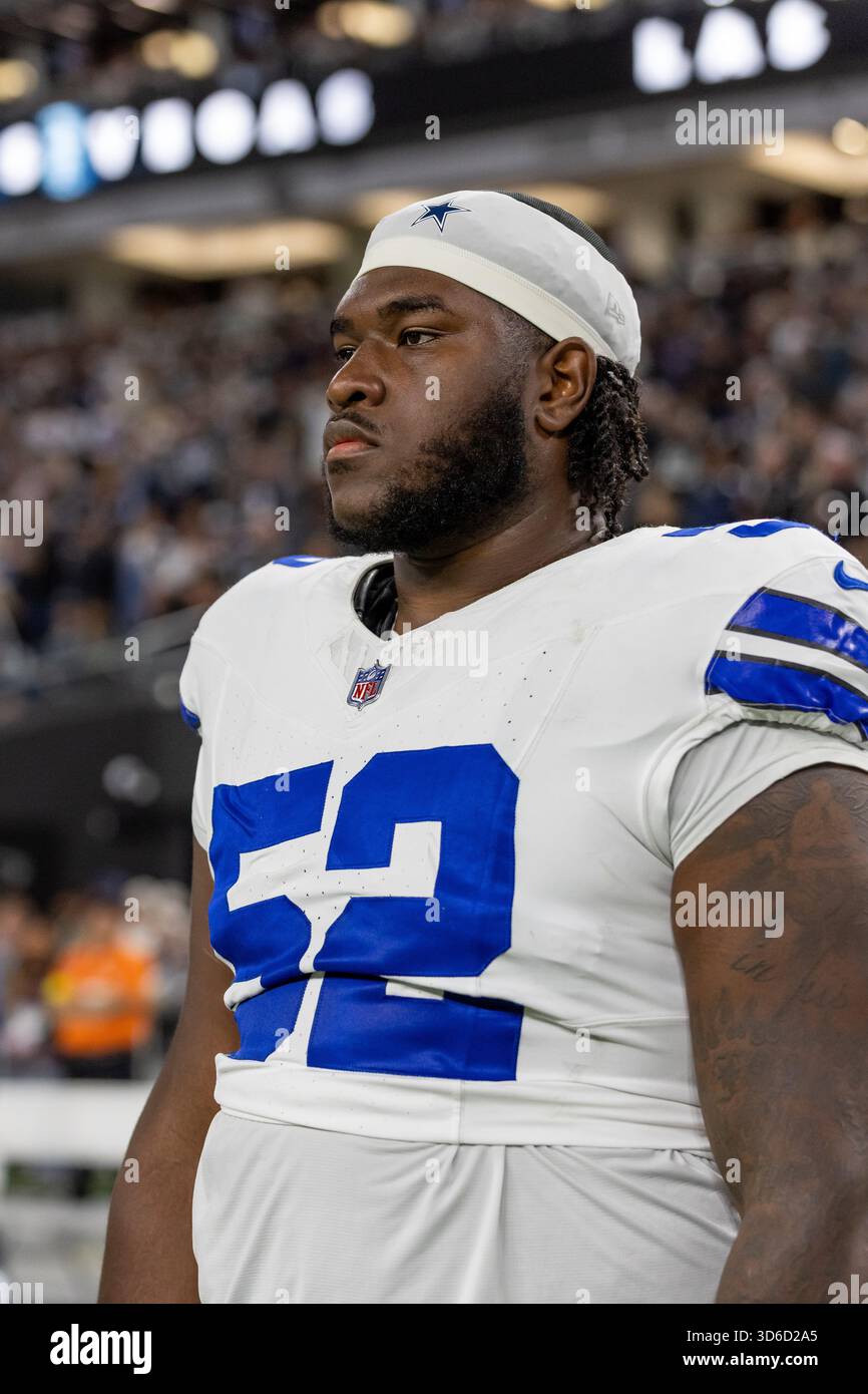 Dallas Cowboys guard Tyler Booker (52) stands for the national anthem ...