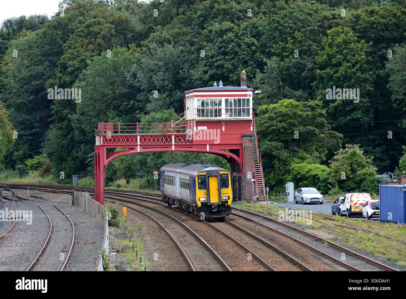 Northern Trains DMU at Hexam station, passing under the historic Grade ...