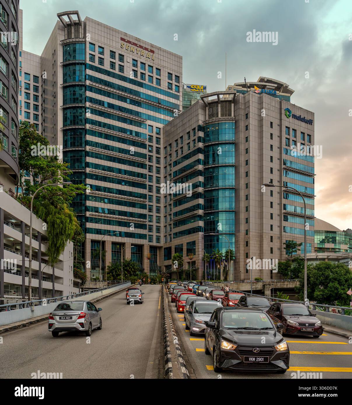 Kuala Lumpur, Malaysia - Feb. 28, 2025: Traffic on a road with modern ...