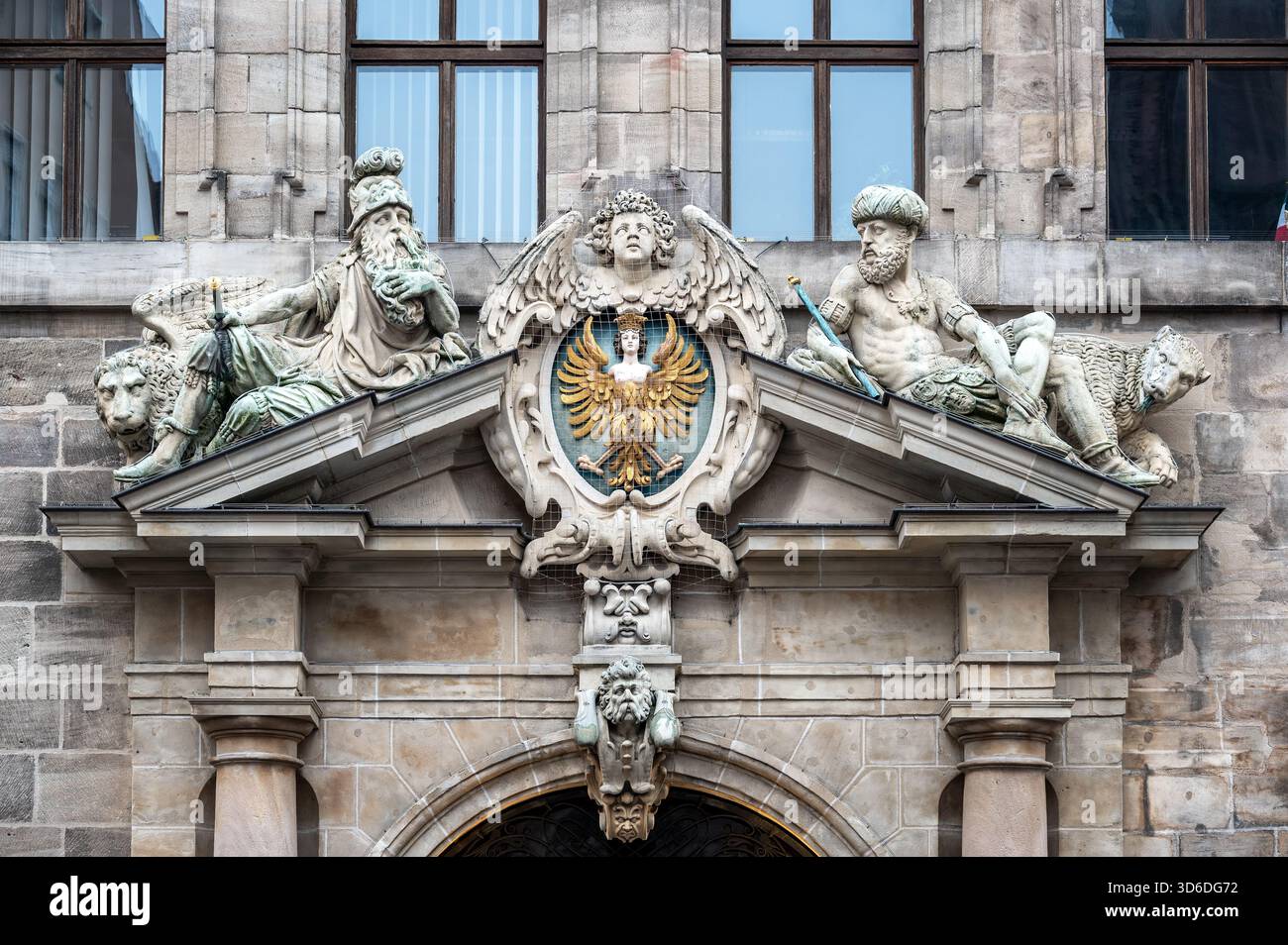 Detailed baroque sculptures and crest above the historic entrance of ...