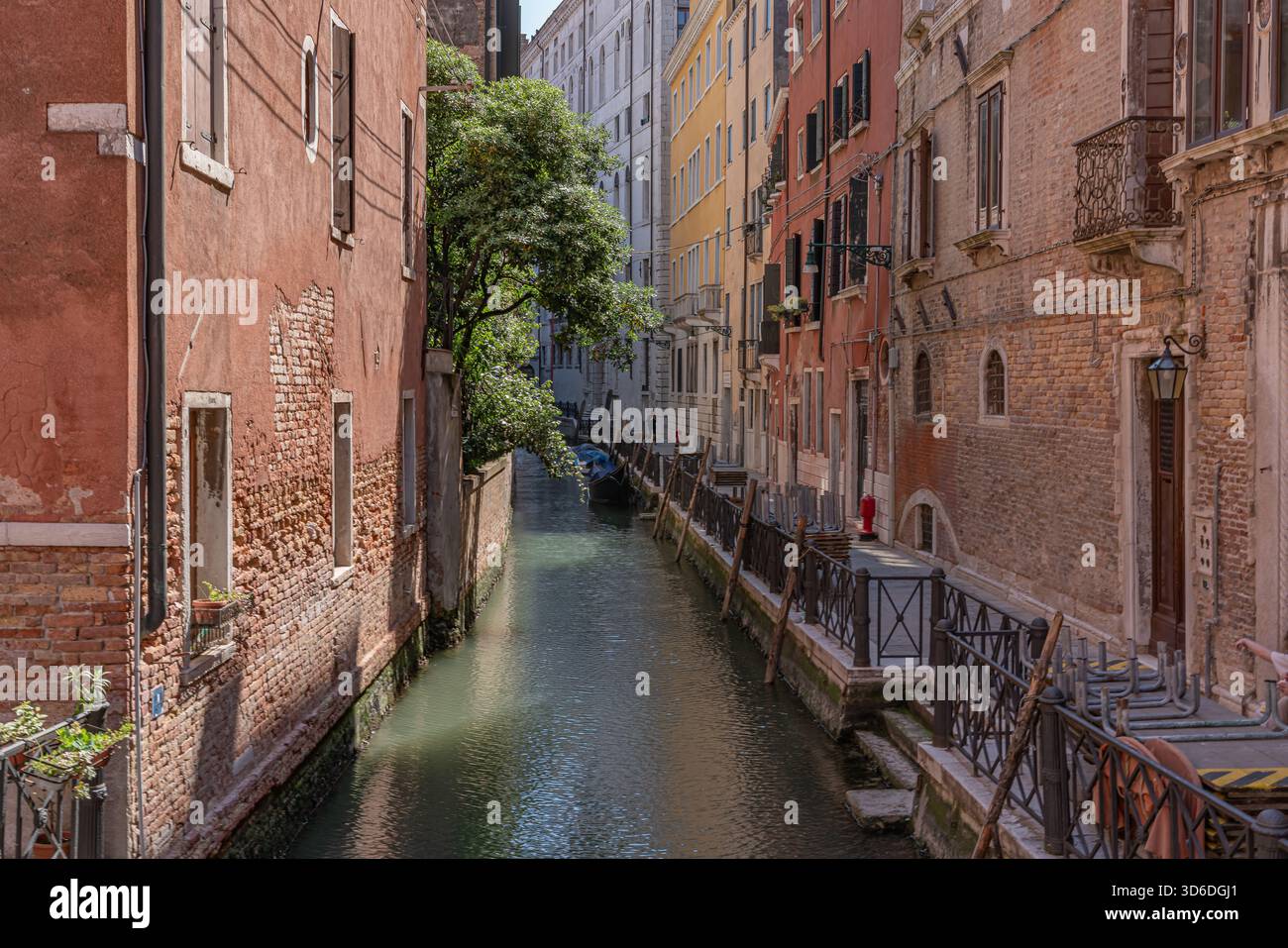 Authentic romantic narrow street in Venice, Italy, atmospheric old town ...