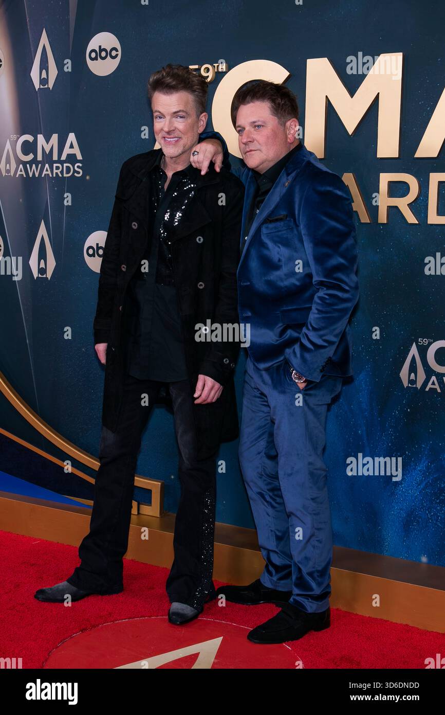 Joe Don Rooney and Jay DeMarcus of Rascal Flats walk the red carpet ...