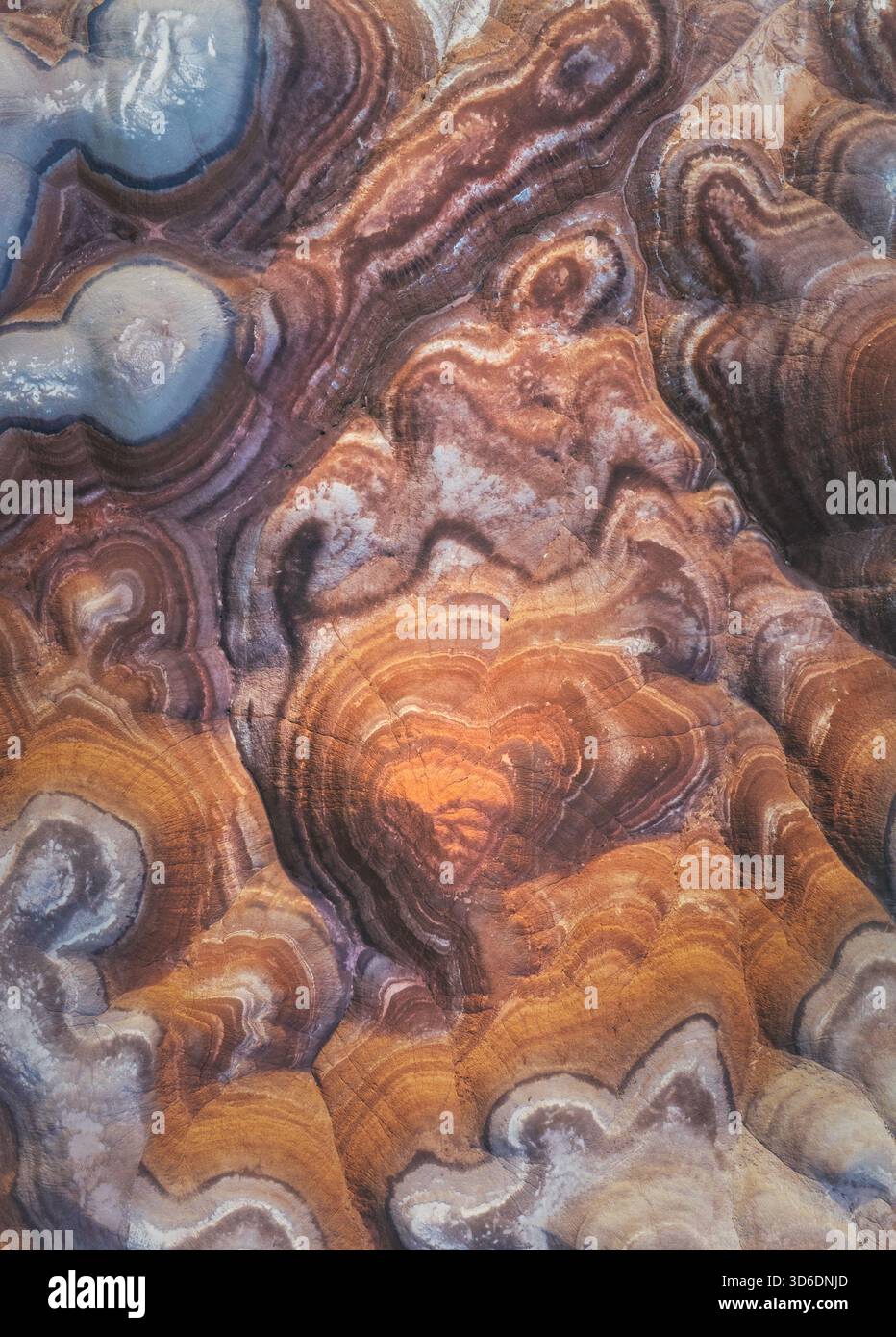 Aerial view of nature's canvas painted in warm earth tones, swirling ...