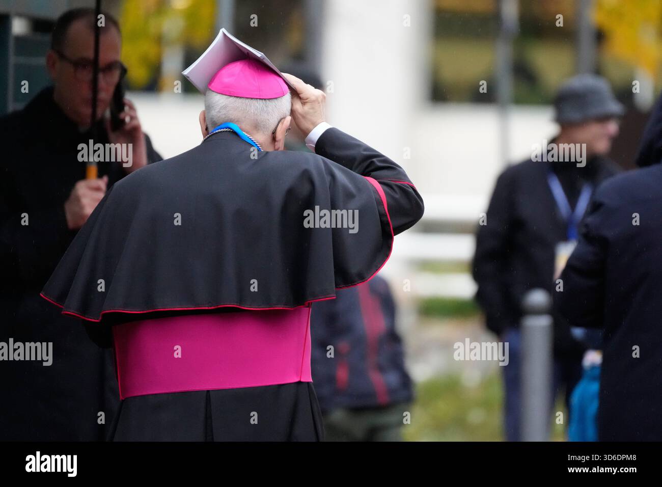 A bishop leaves the Basilica of Santa Maria degli Angeli in Assisi ...