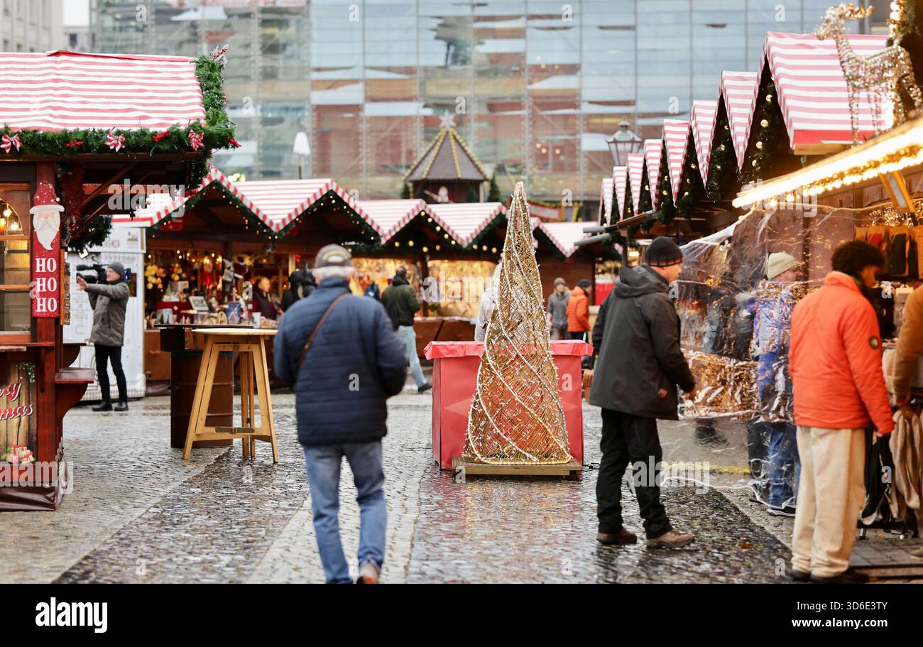 Visitors walk through the Magdeburg Christmas market after the opening ...